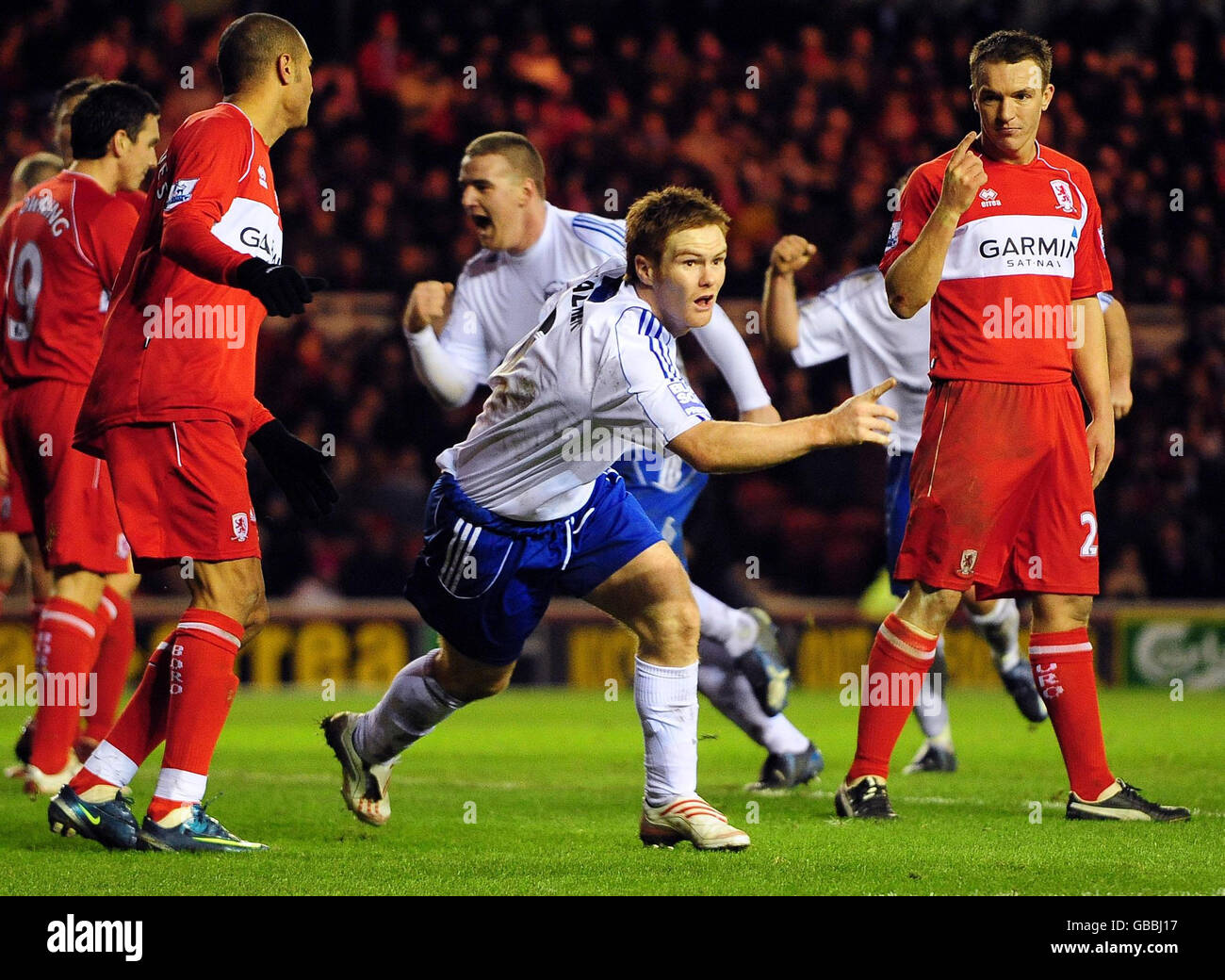 Barrow's Jason Walker (centre) wheels away in celebration after scoring ...
