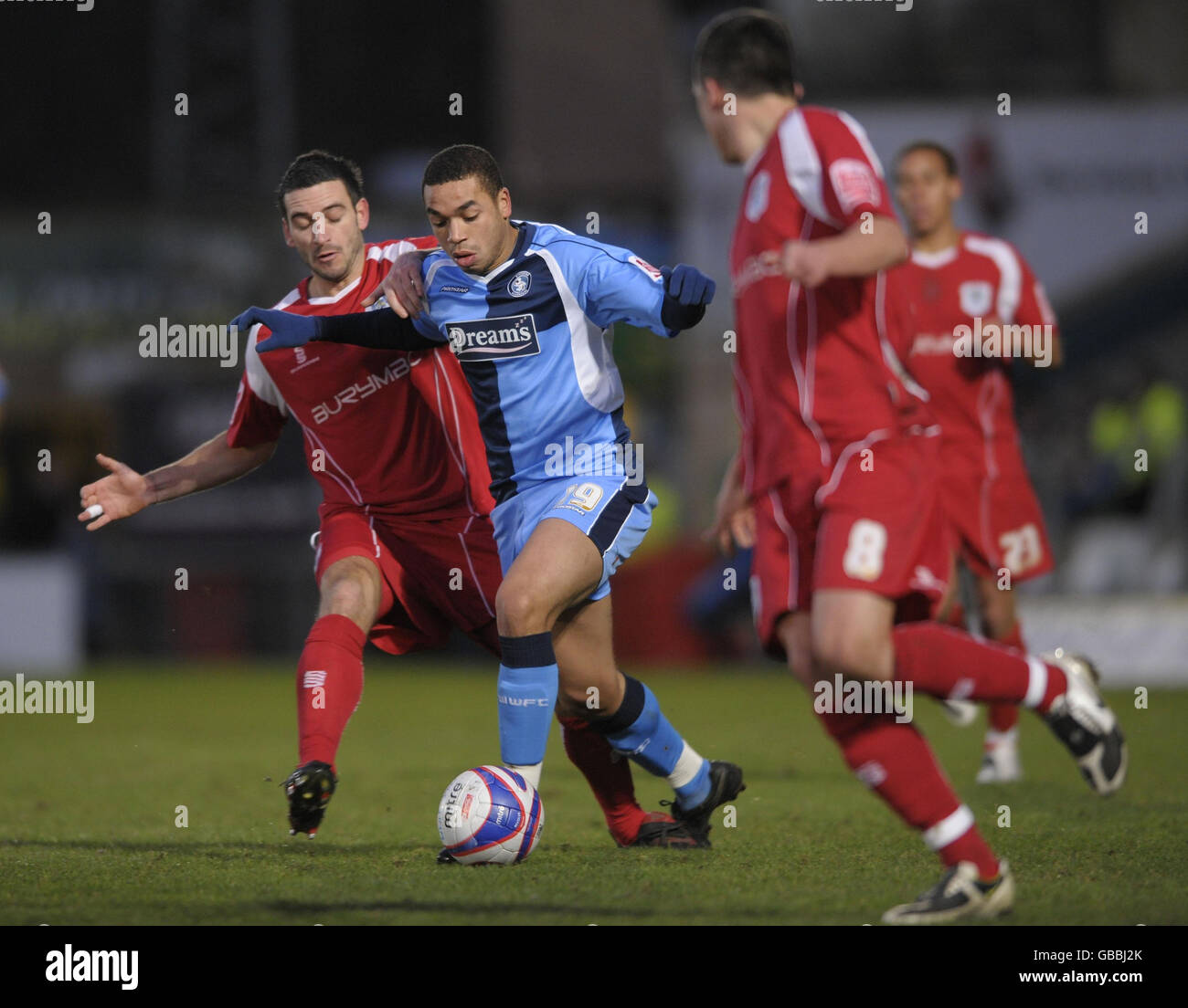 Wycombe's Lewis Spence in action with Bury's Paul Scott during the Coca ...