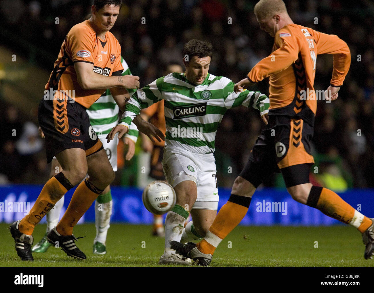 Dundee United defenders Lee Wilkie (left) and Garry Kenneth challenge ...