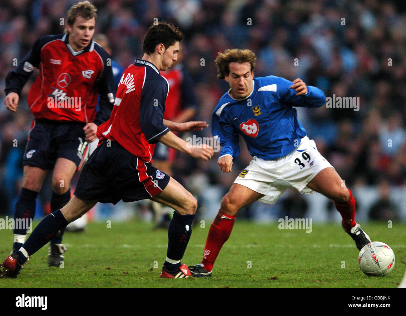 Portsmouth's Eyal Berkovic and Scunthorpe United's Matthew Sparrow ...