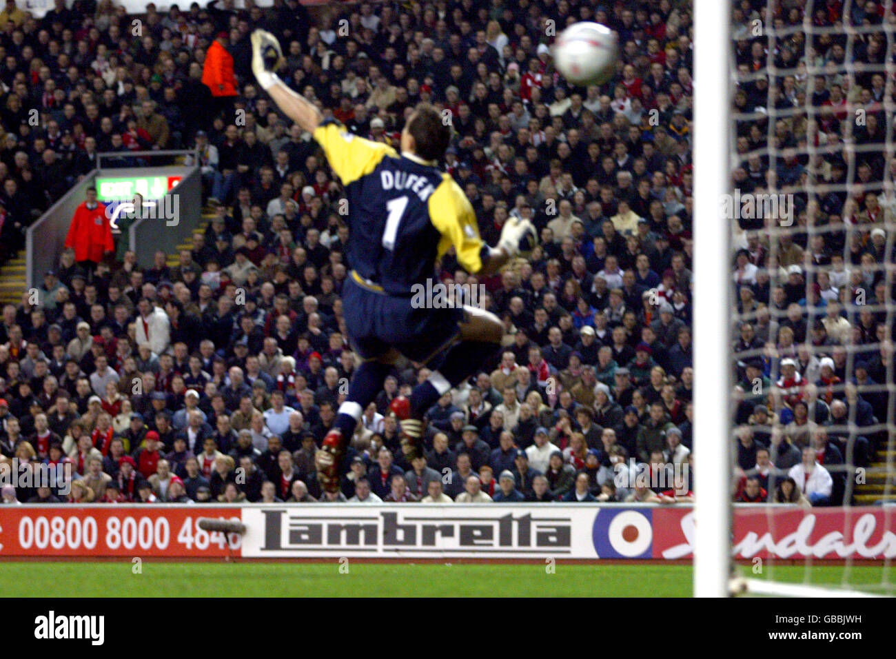 Liverpool's goalkeeper Jerzy Dudek flaps and misses a shot from a ...