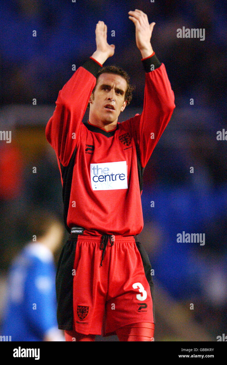 Wimbledon's Peter Hawkins applauds the travelling support Stock Photo ...