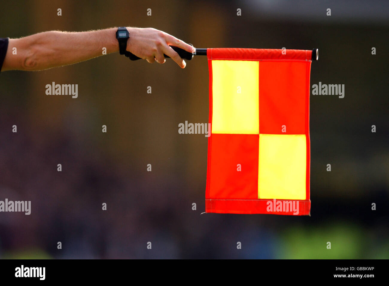 The linesman raises his flag to signal offside hi-res stock photography ...