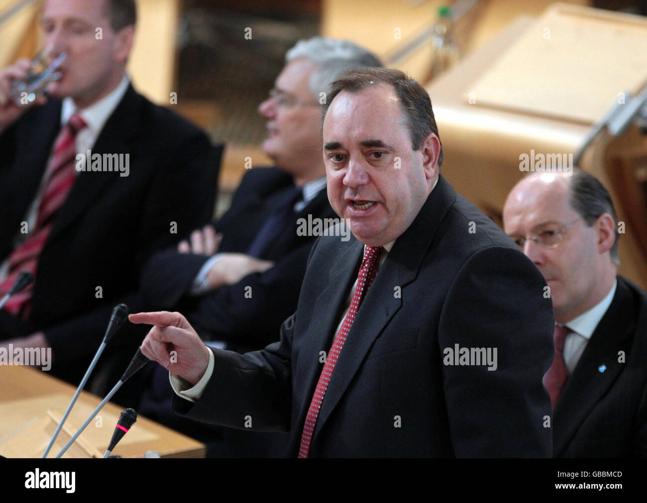 Half length mid top speaking serious mike mic microphone scotland hi ...