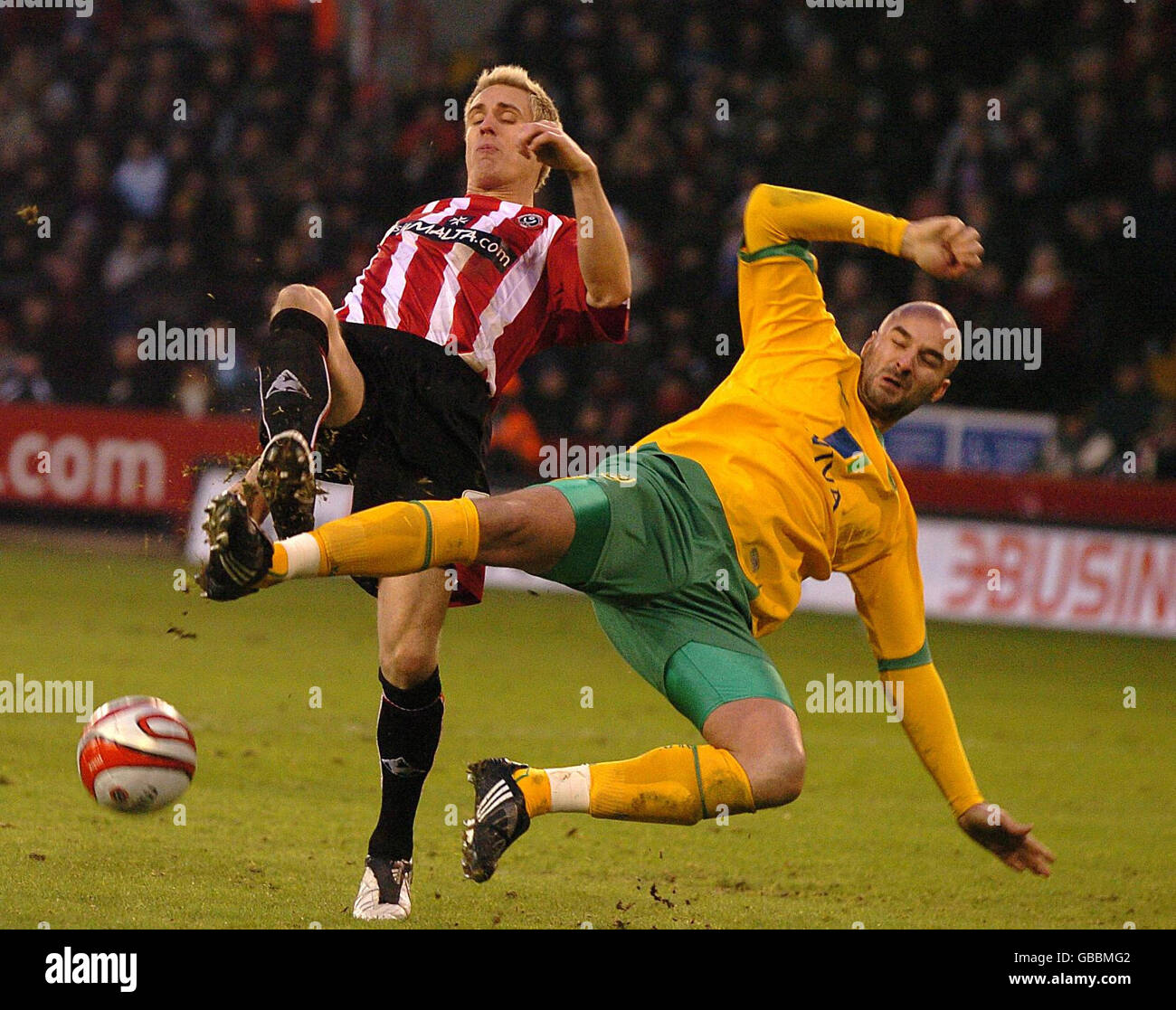 Sheffield United's Matthew Kilgallon (left) battles with Norwich's ...