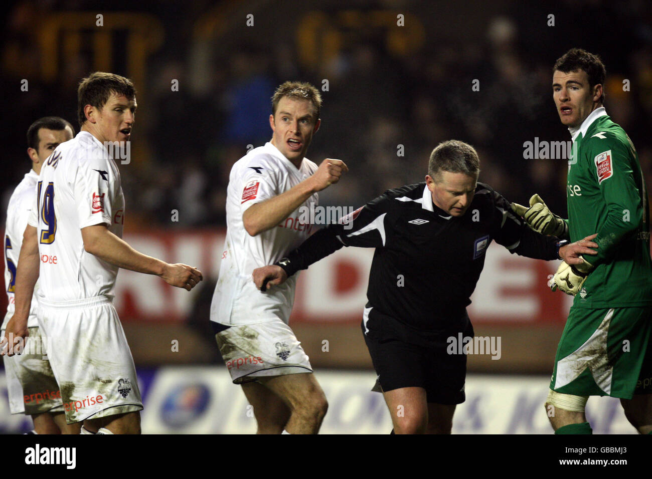 Referee Colin Webster pushes aside the protests of Preston North End's ...