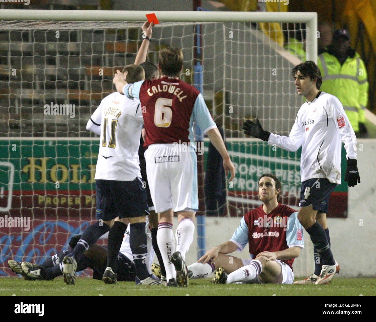 Burnley's Michael Duff (sitting) is sent off during the game against ...