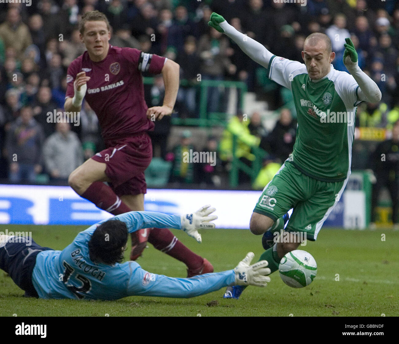 Hearts goalkeeper Janos Balogh stops Hibernian striker Steven Fletcher ...