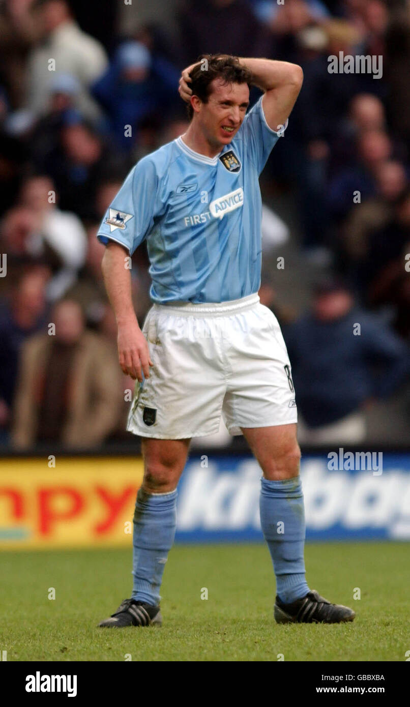 Manchester City's Robbie Fowler stands dejected after missing a chance ...