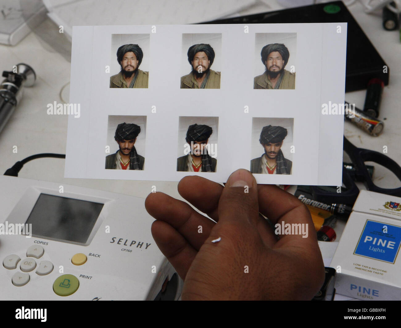 An International Electoral Commission employee makes identification ...