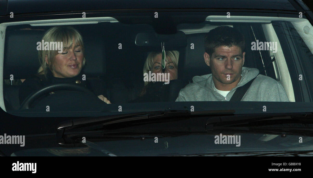 Alex Curran (left), arrives home with her husband Steven Gerrard at ...