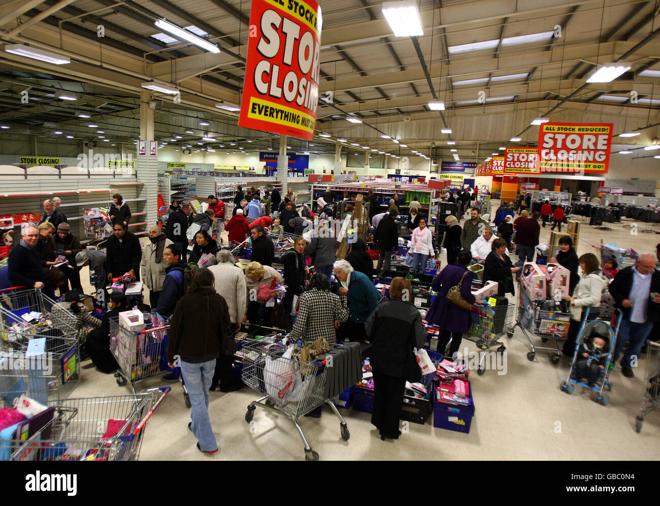 Shoppers look for discounted items at a Woolworths store in Edinburgh ...