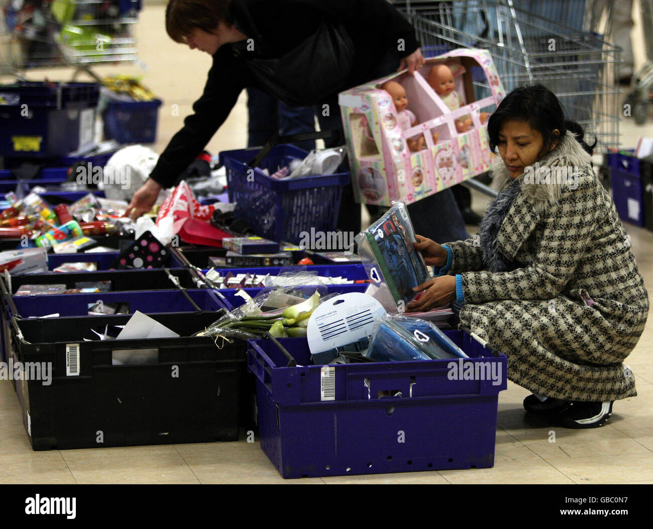 Shoppers look for discounted items at a Woolworths store in Edinburgh ...