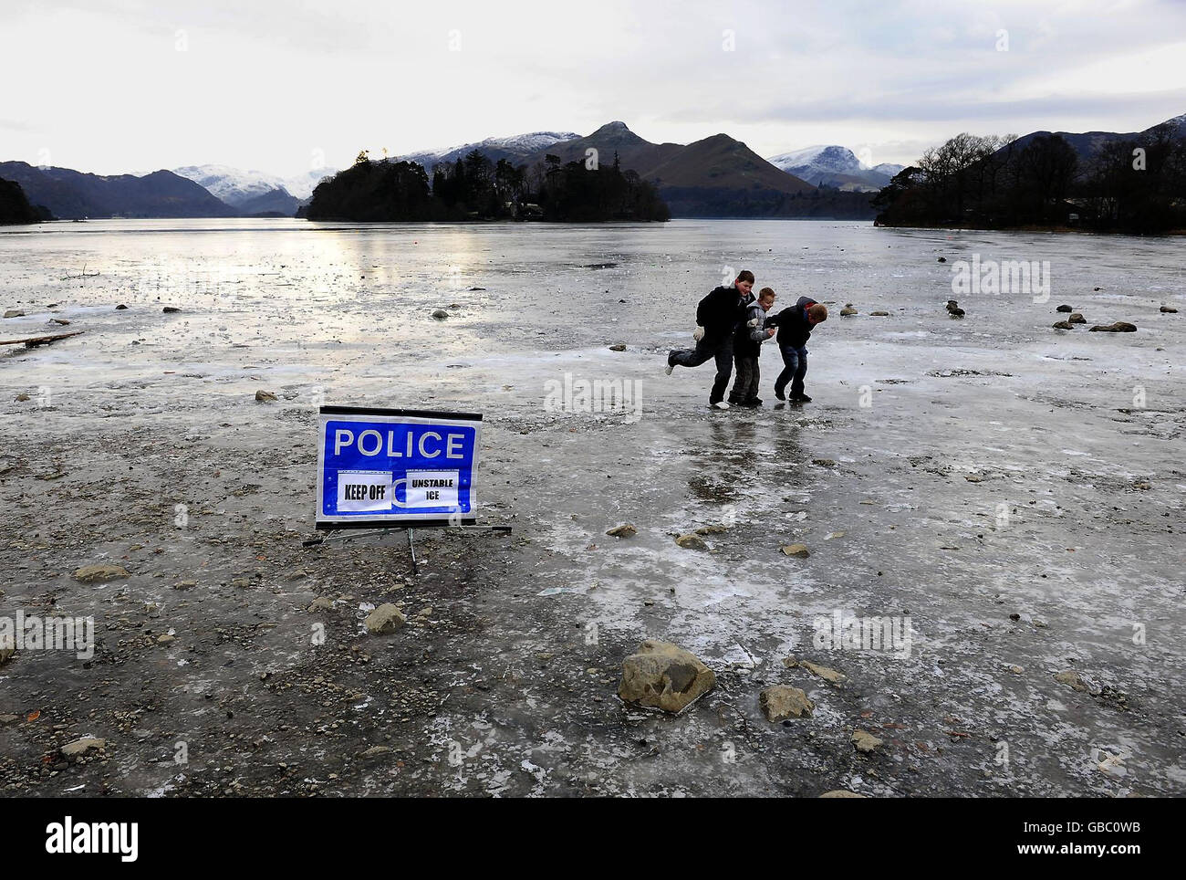 Derwentwater near Keswick frozen solid with a Police Ice warning sign ...