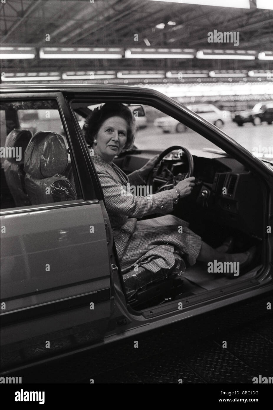 Prime Minister Margaret Thatcher at the wheel of a Bluebird car at ...