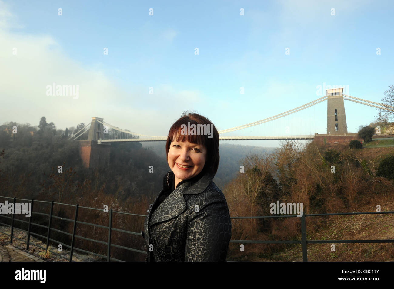 Writer Catherine Johnson poses in front of the Clifton Suspension ...