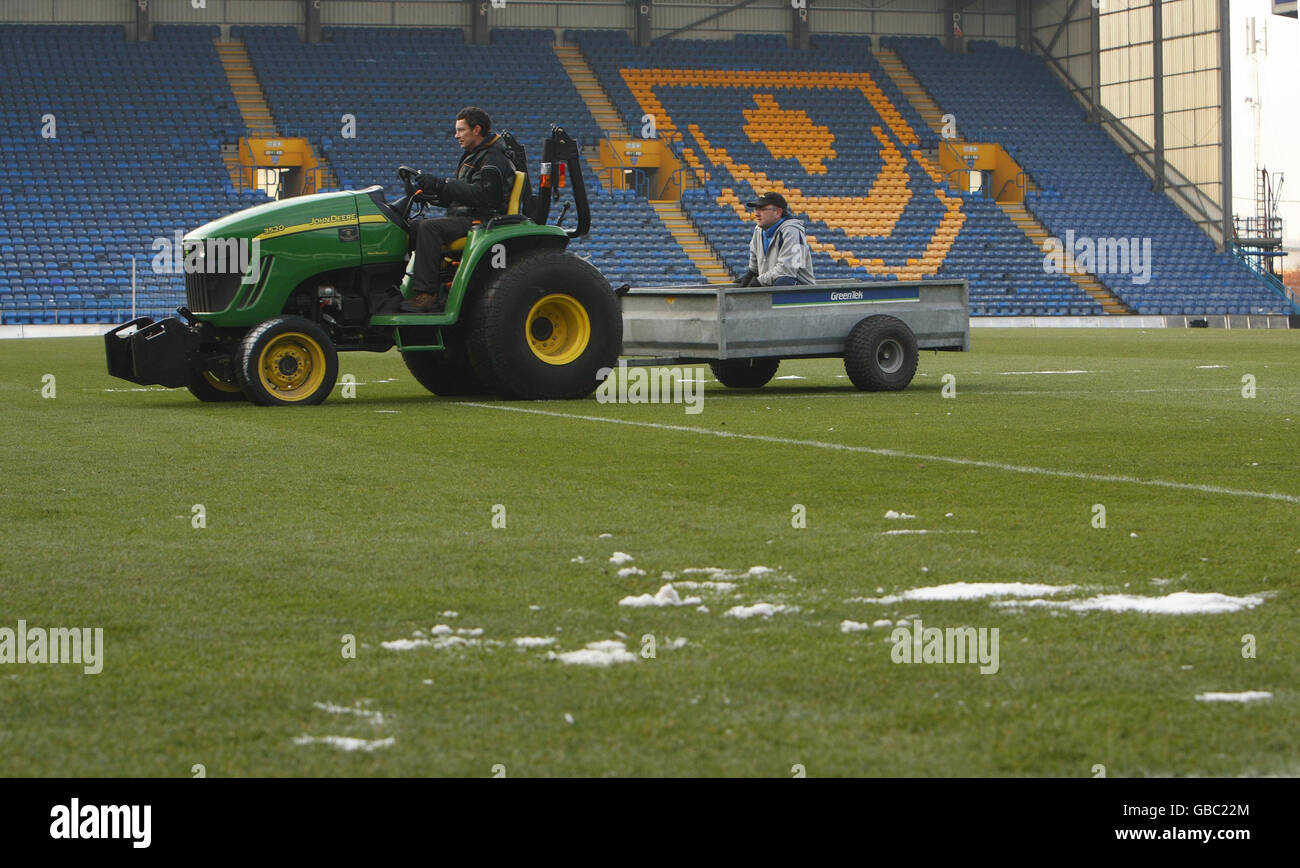 Patches of ice are visible on the surface of the pitch at Fratton Park ...