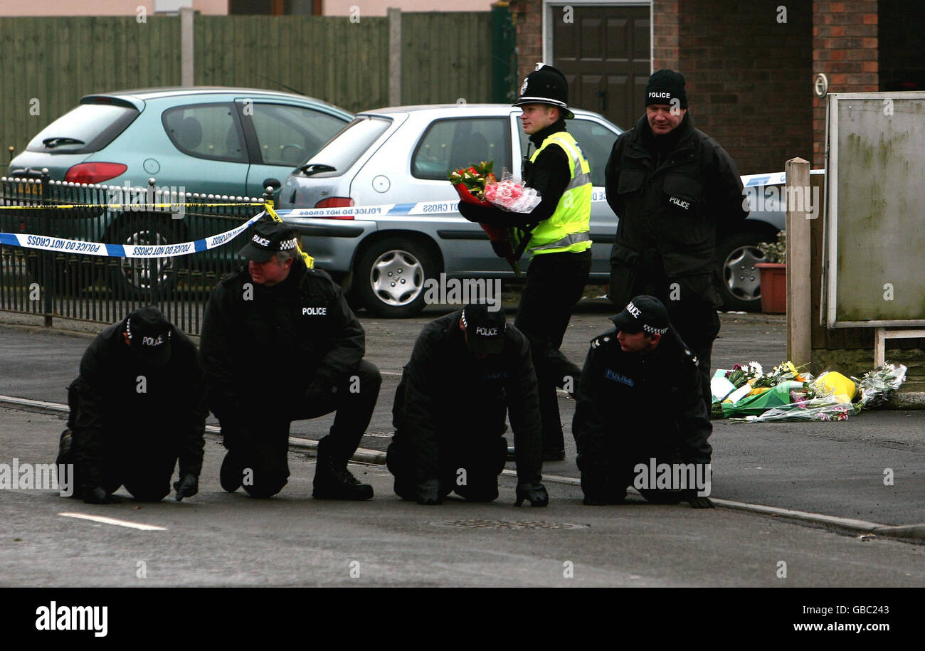 Police search the area outside Fairfield Stores and Post Office, where ...
