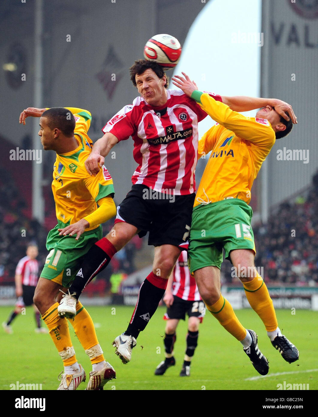 Sheffield United's Darius Henderson (centre) wins the ball under ...