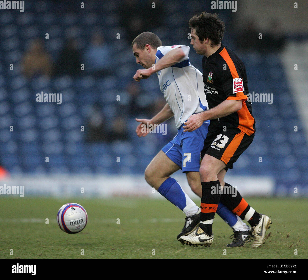 Bury's Stephen Dawson and Barnet's Ryan Burge during the Coca-Cola ...