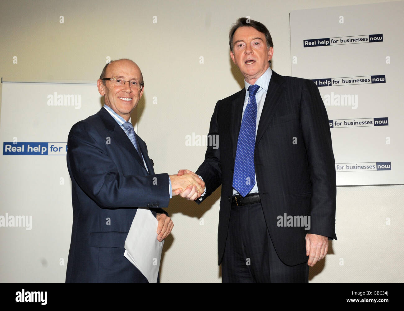 Business Secretary Peter Mandelson (right) shakes hands with chairman ...