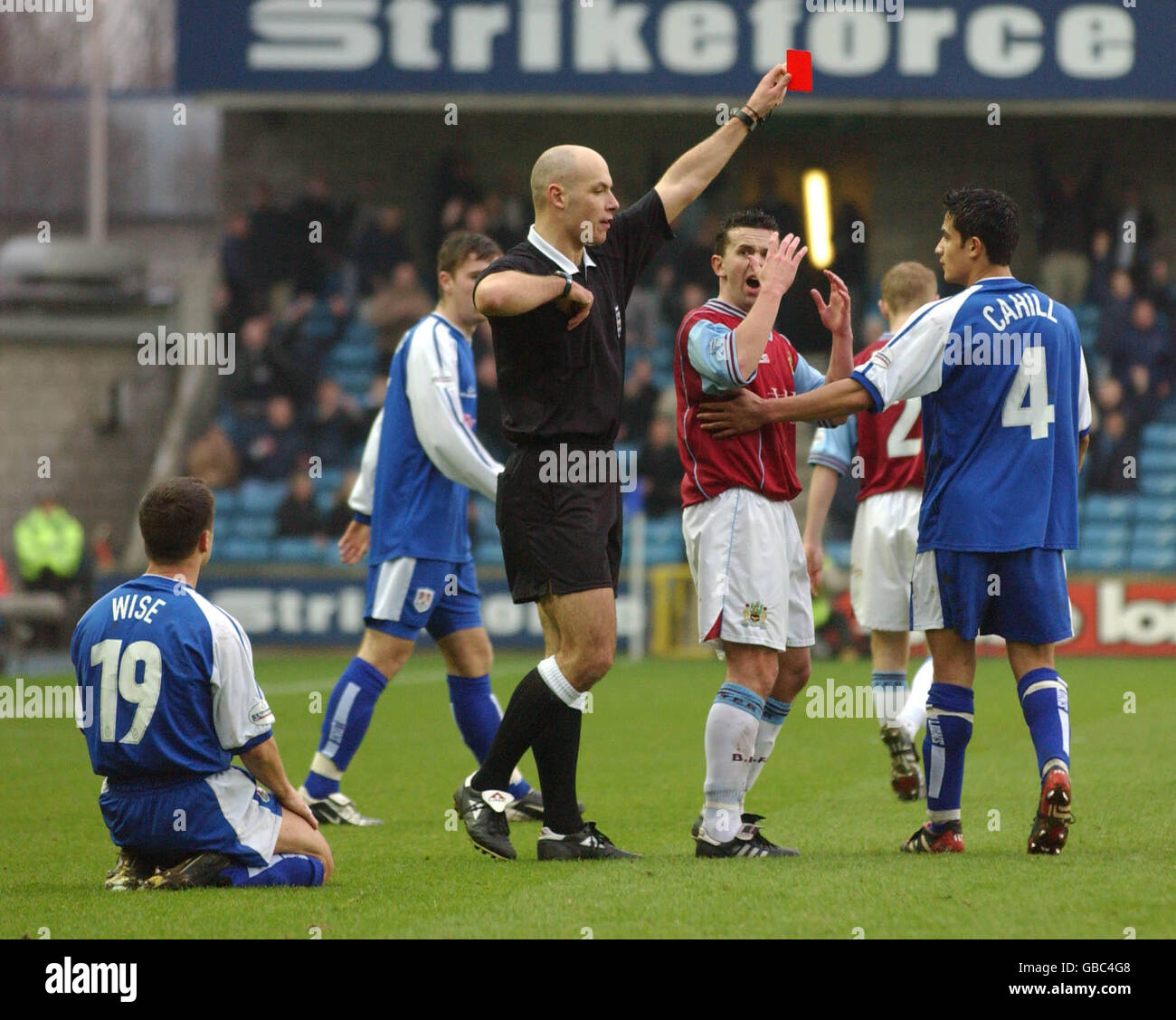 Referee Mr Howard Webb shows Burnley's Paul Weller the red card after ...