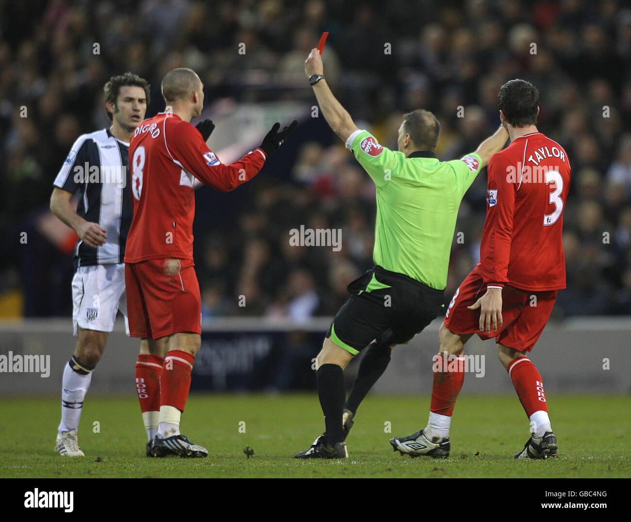 Maych referee Mark Halsey (centre right) shows Middlesbrough's Didier ...