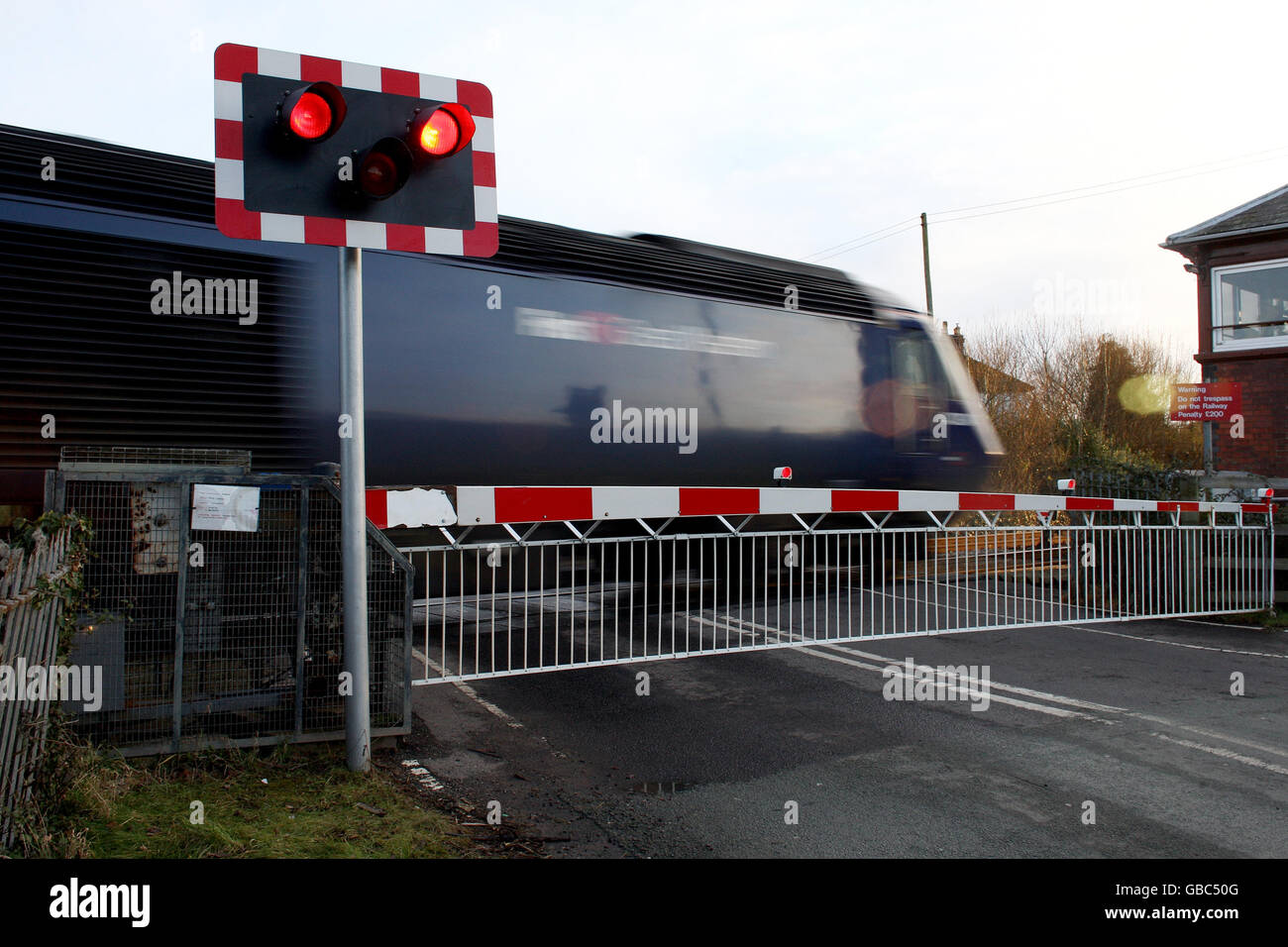 Train Level crossing stock Stock Photo - Alamy