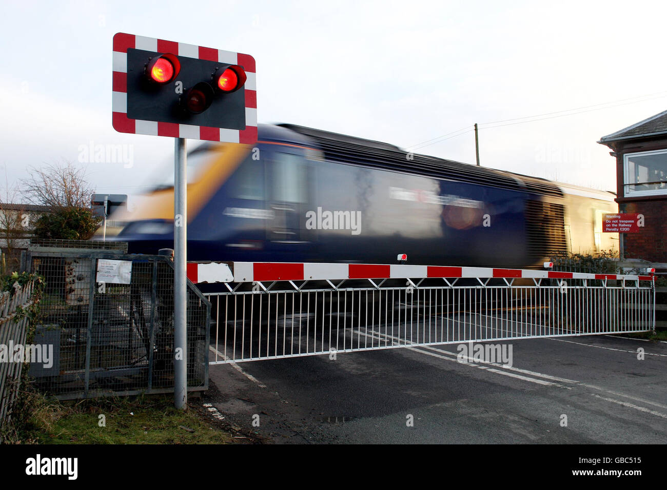 An Inter City First Great Western train passes through a level crossing ...