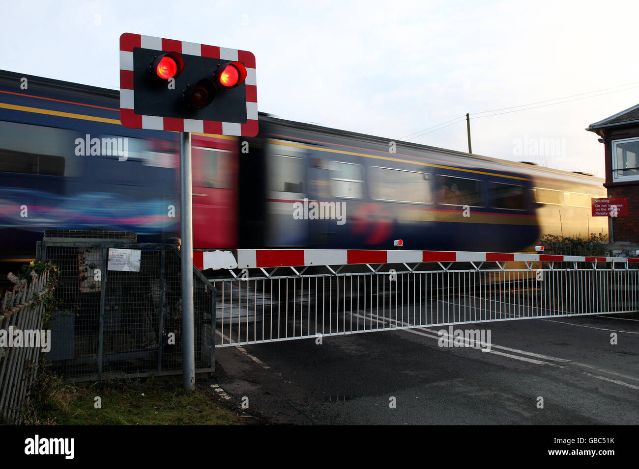 An Inter City First Great Western train passes through a level crossing ...
