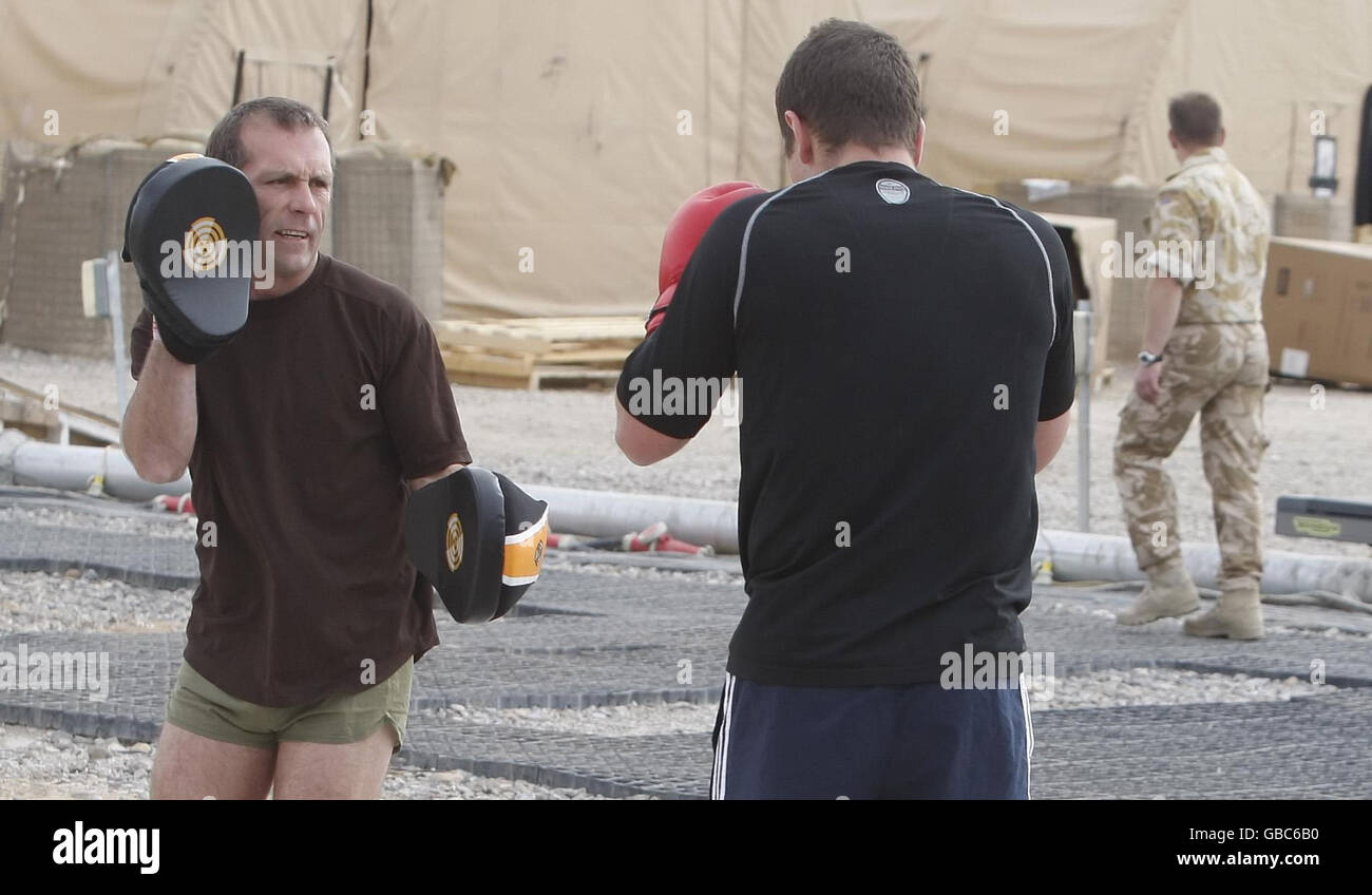 Capt Robbie Robertson (left) and Capt Olly Denning spar at Camp Bastion ...