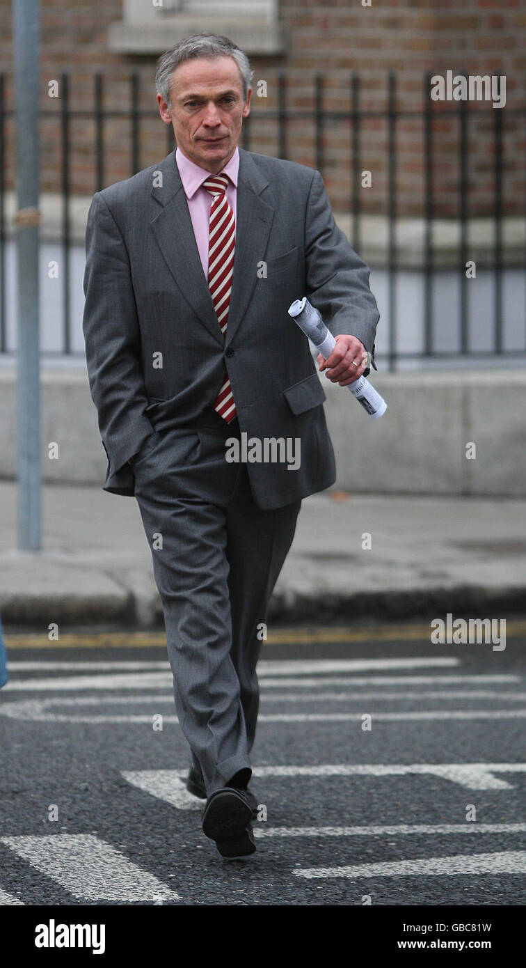 Fine Gael's Richard Bruton on his way into the Dail on the first day ...
