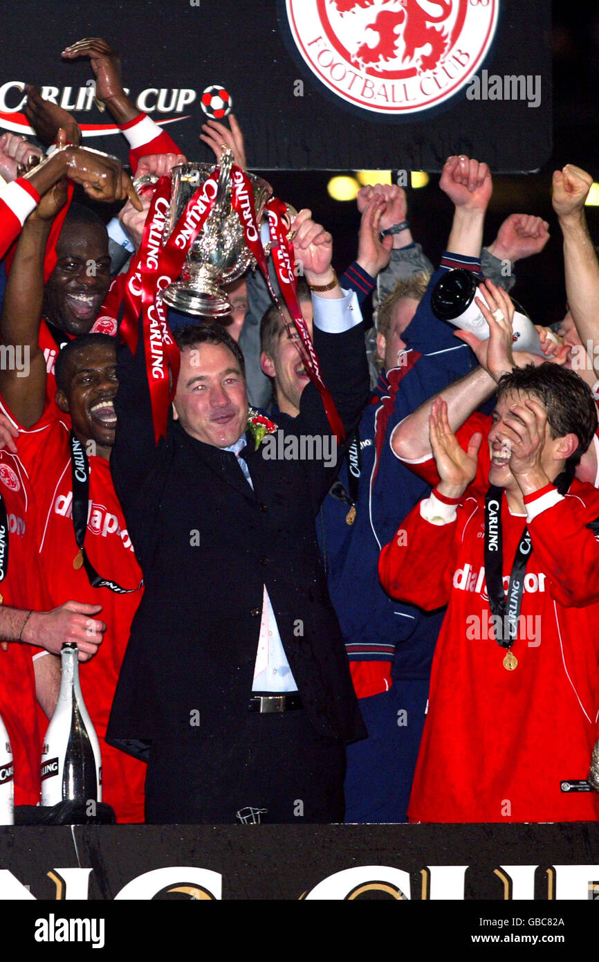 Middlesbrough's chairman Steve Gibson (c) lifts the Carling cup trophy ...
