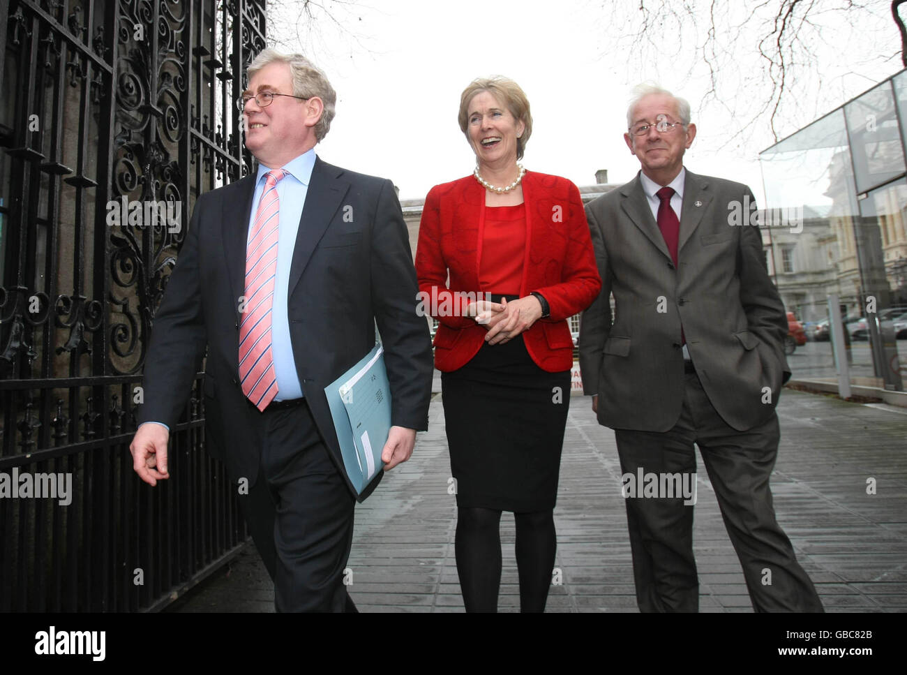 Labour Leader Eamon Gilmore (left) on his way into the Dail with Labour ...