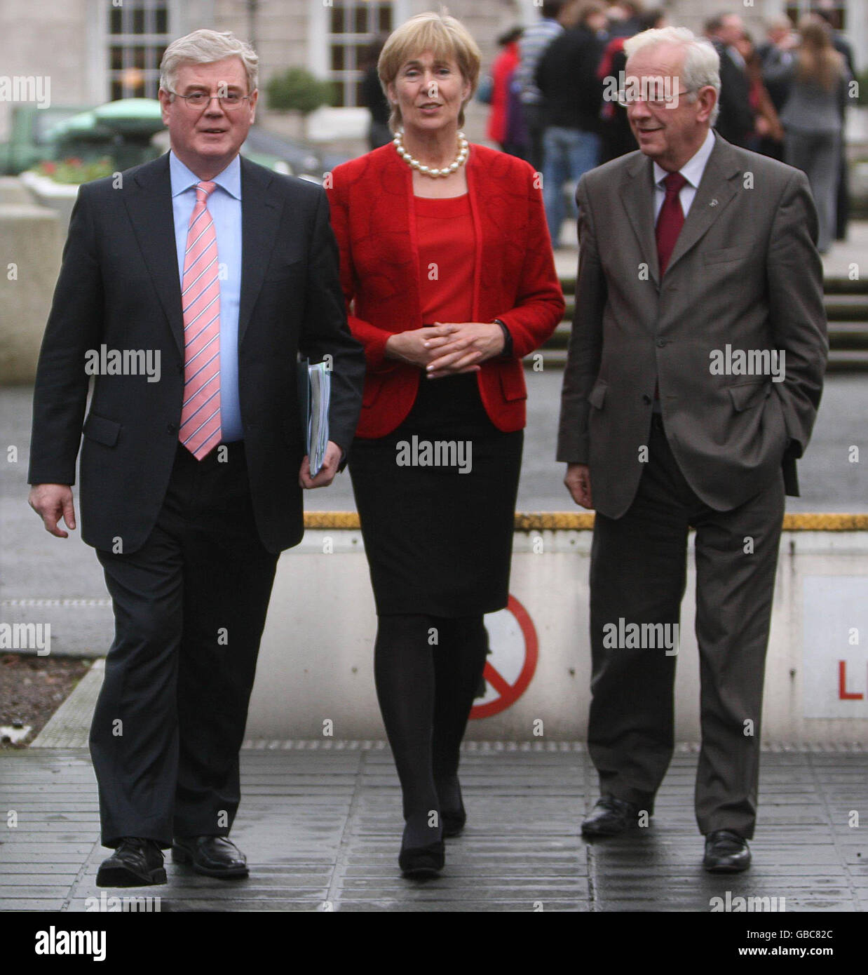 Labour Leader Eamon Gilmore (left) on his way into the Dail with Labour ...