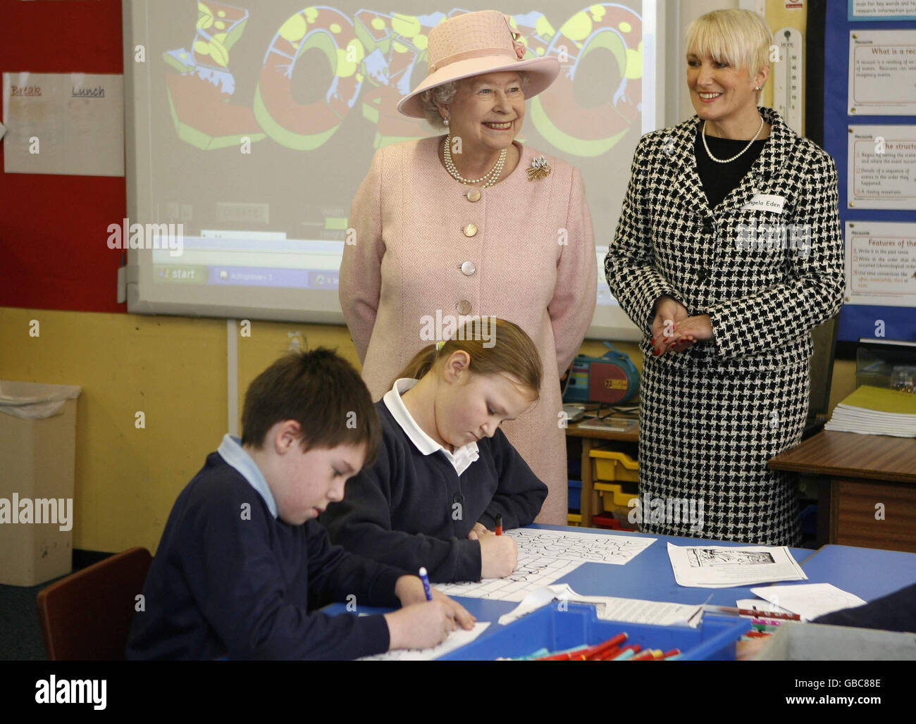 Britain's Queen Elizabeth is shown a classroom by head teacher Angela ...
