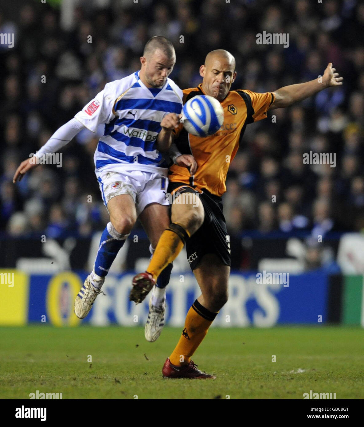 Reading's Noel Hunt and Wolves' Nigel Quashie compete for possession ...