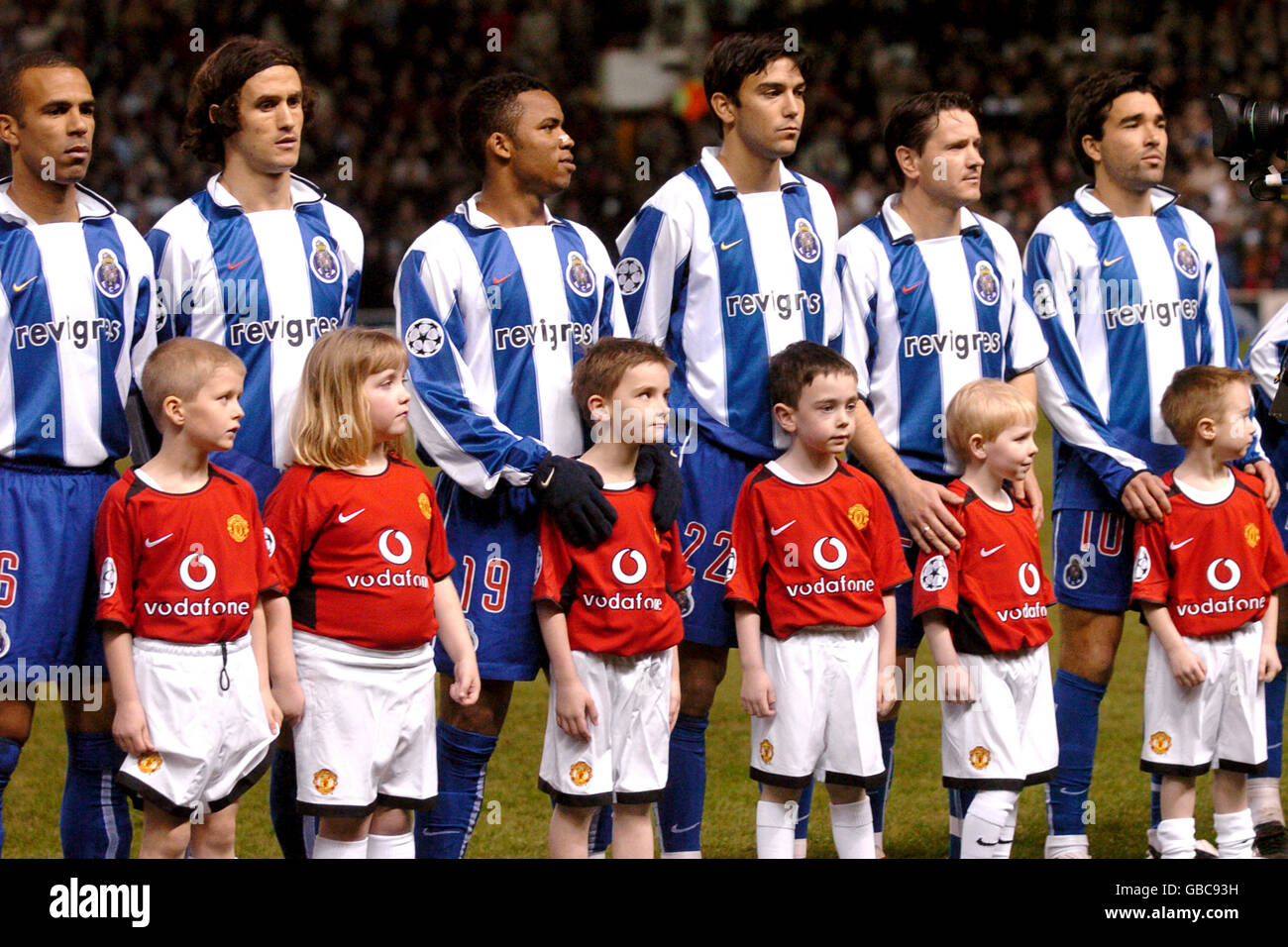 The FC Porto players line up with the mascots before the game Stock ...