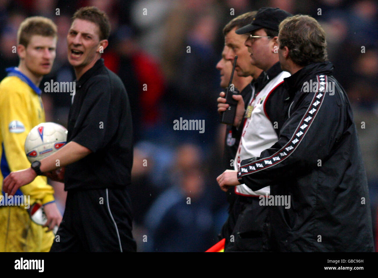 Oldham Athletic's Manager John Sheridan (r) has words with referee Mr ...
