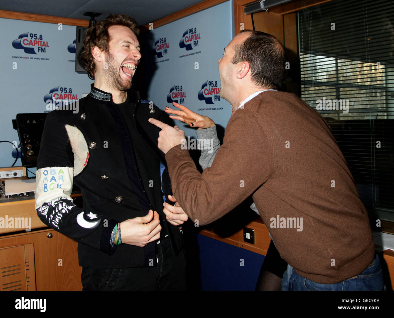 Capital Breakfast show presenter Johnny Vaughan with guest Chris Martin ...