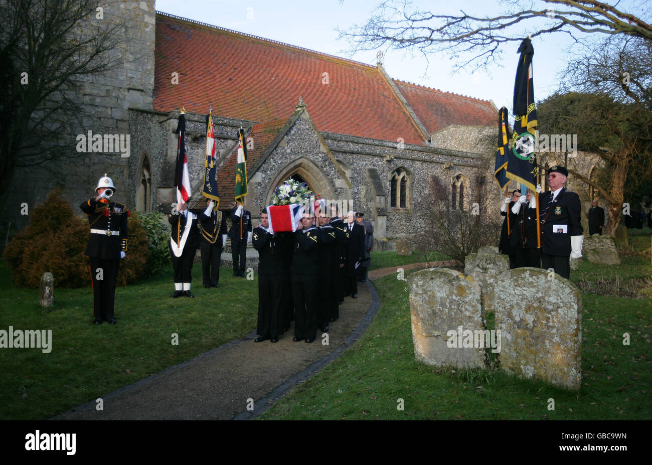 A Royal Marine Bugler sounds last post over the coffin of William "Bill ...