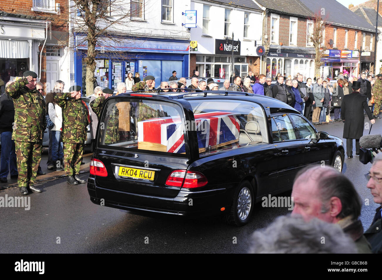 The repatriation cortege passes through the High Street of Wootton ...