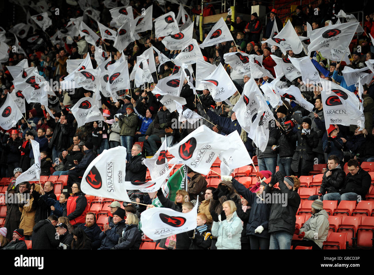 Saracens fans wave flags in stands hi-res stock photography and images ...
