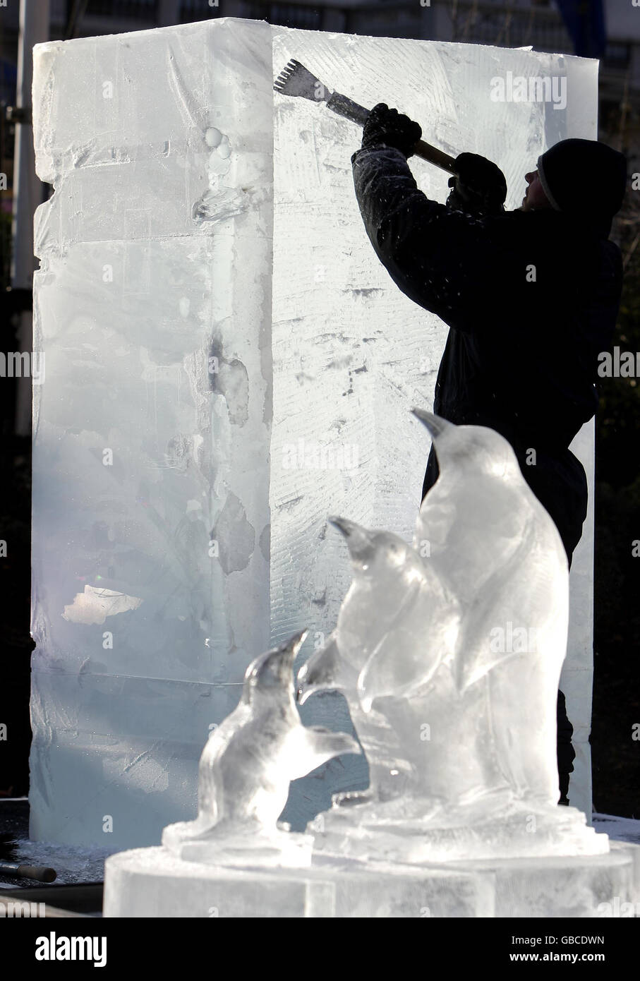 Bulgarian Ice Sculptor Ruslan Korovkov works on an ice sculpture ahead ...