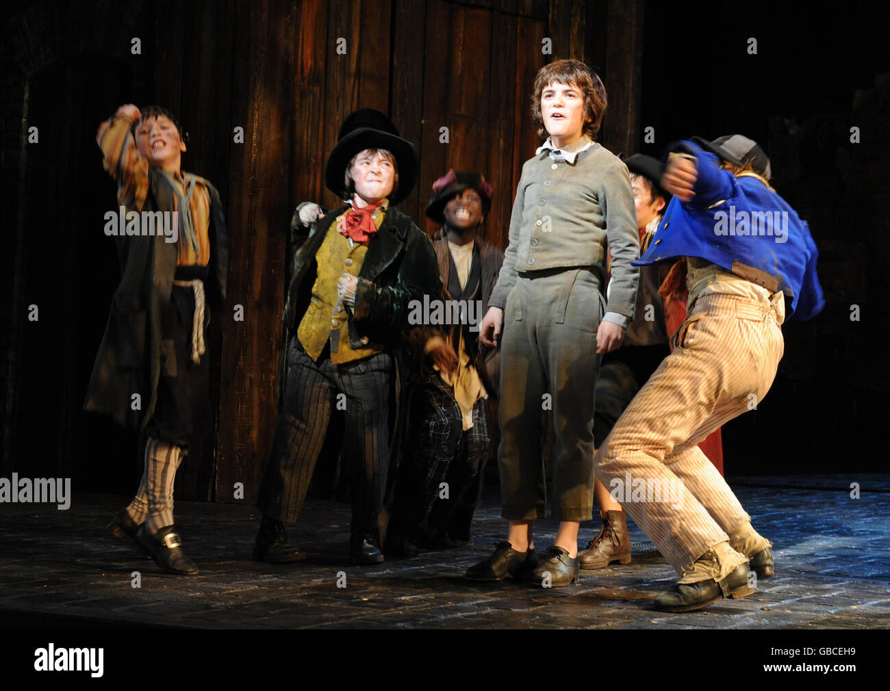 Robert Madge as Dodger (centre left) and and Harry Stott as Oliver ...