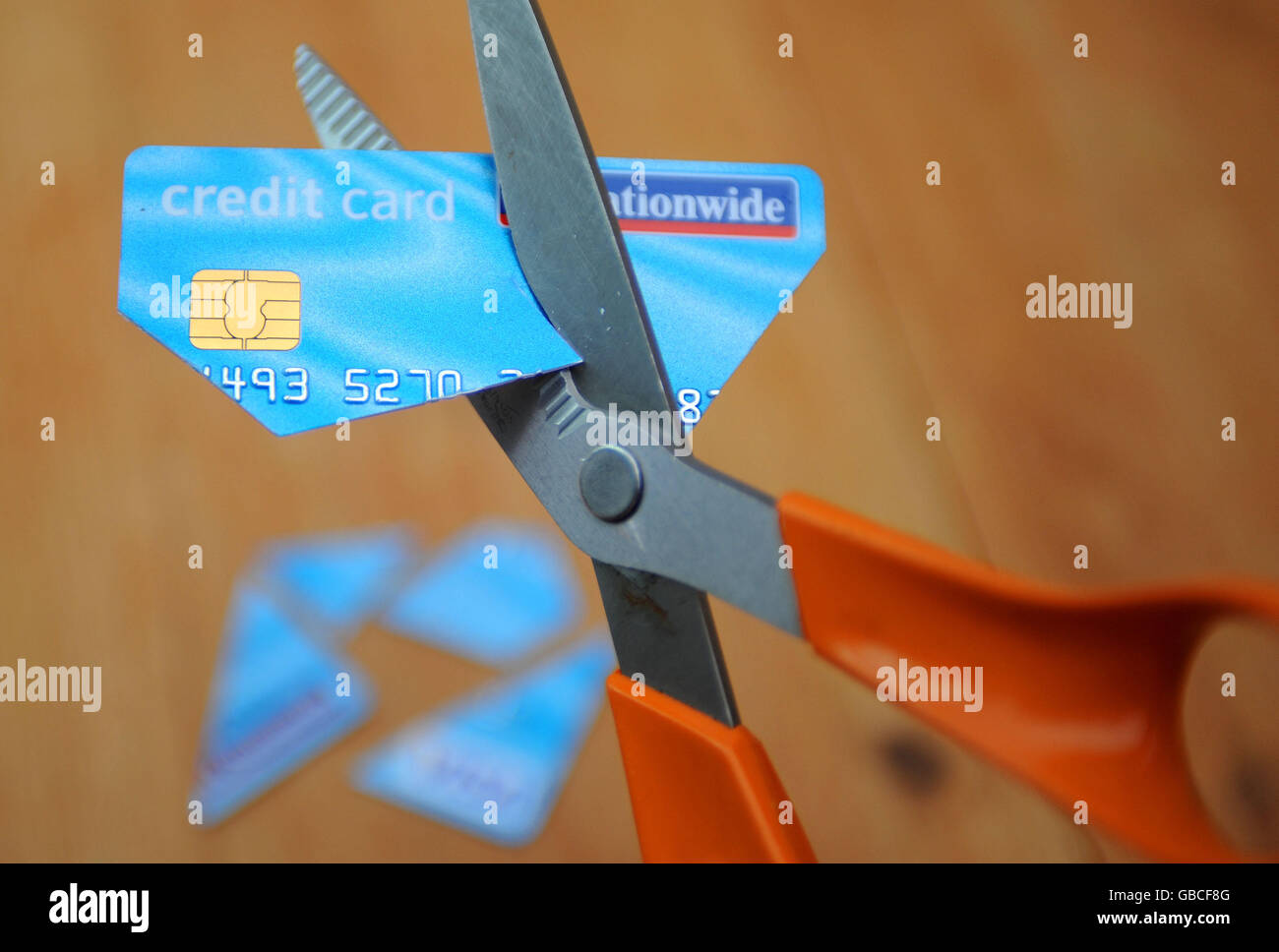 Credit card being cut up Stock Photo - Alamy