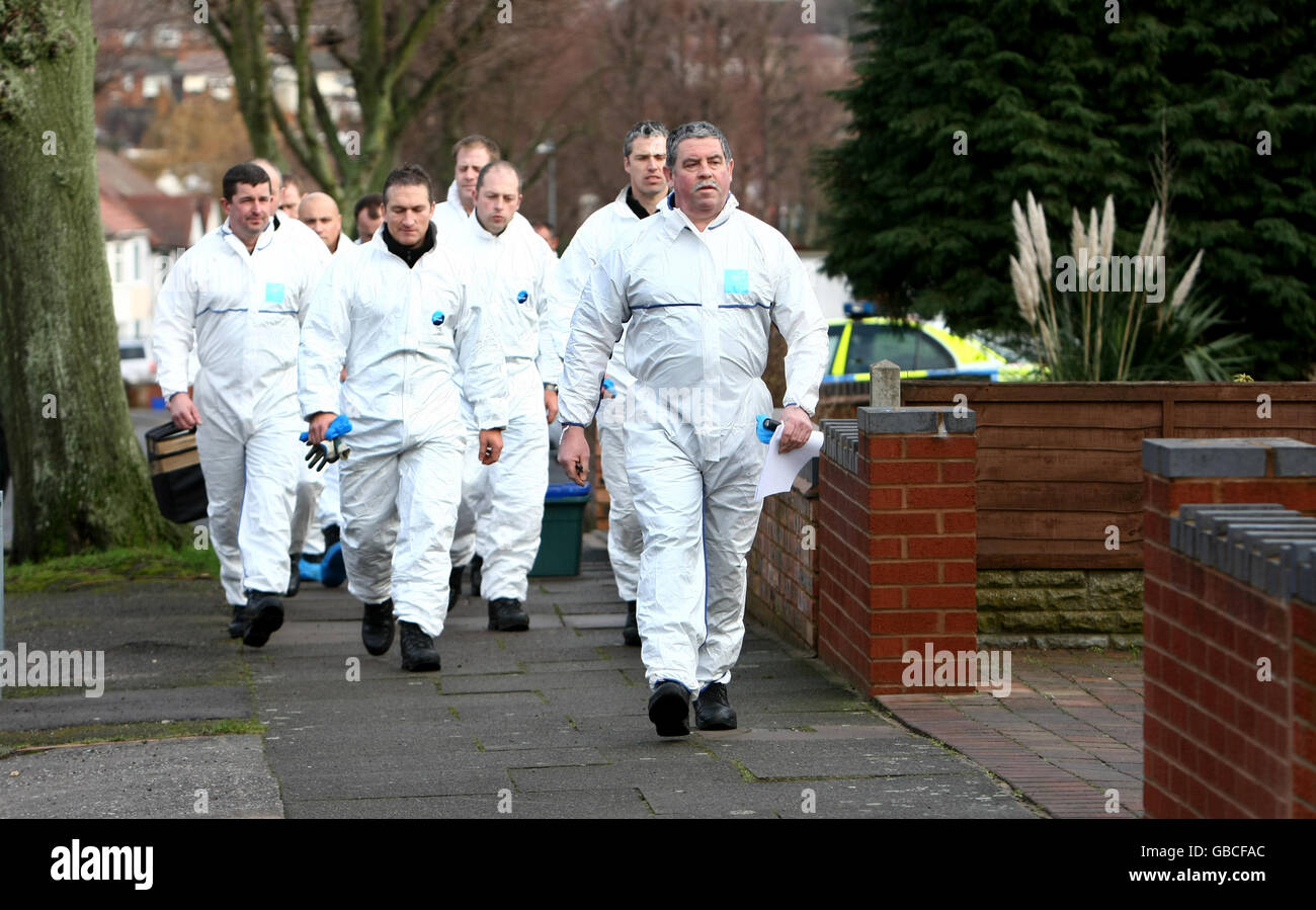 Police Forensic officers enter a house in Sheldon, Birmingham, after ...