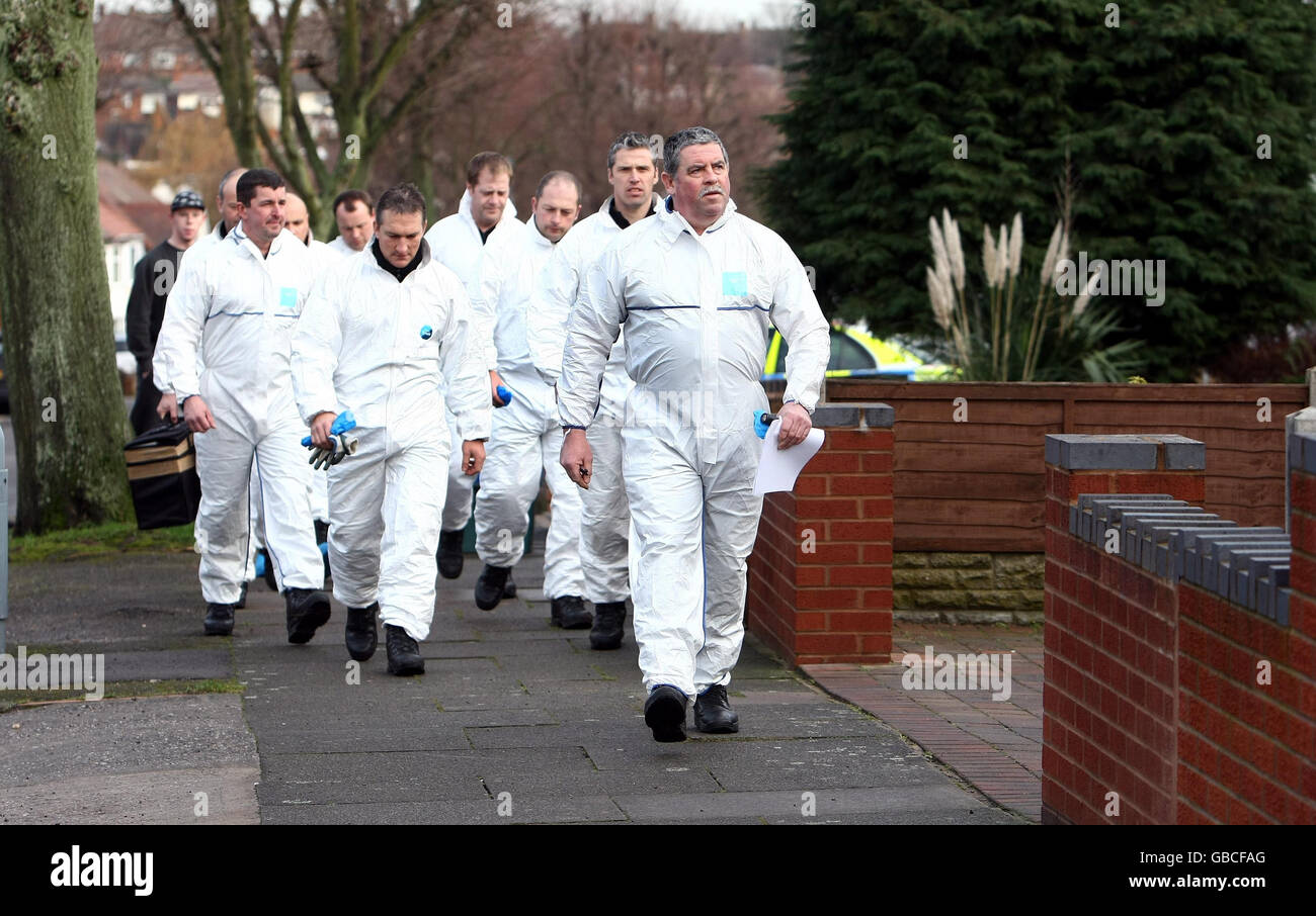 Police Forensic officers enter a house in Sheldon, Birmingham, after ...