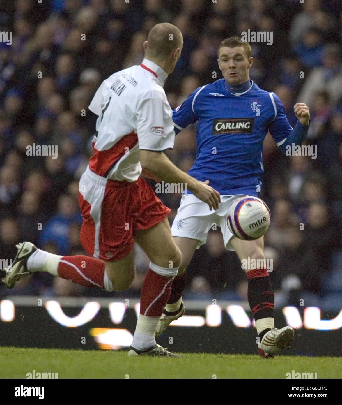 Rangers' John Fleck in action with Falkirk's Lee Bullen during the ...