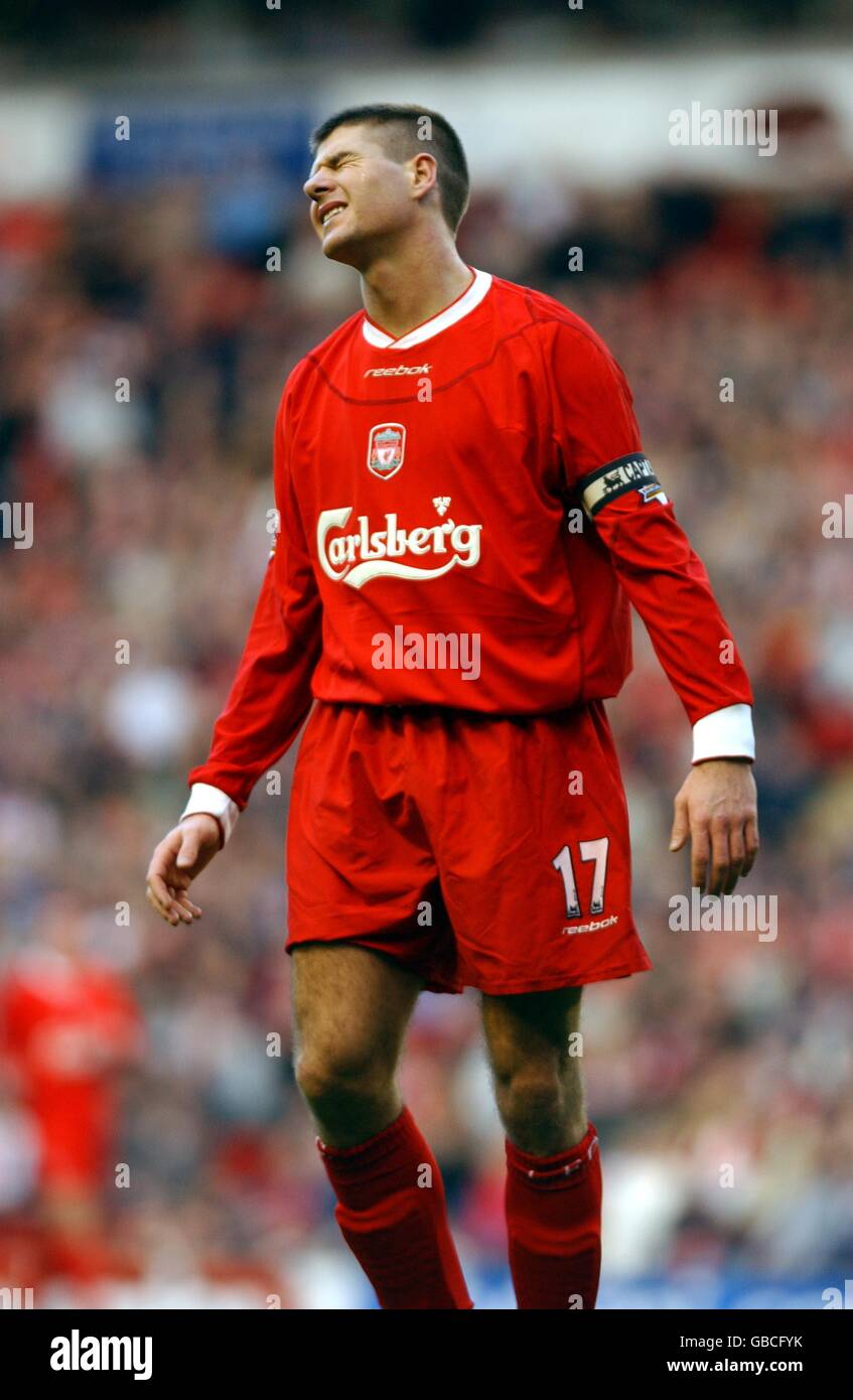 Liverpool's Steven Gerrard stands disappointed as his side can only ...